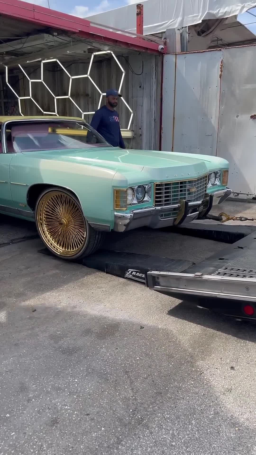 Kodak Black’s 71 Chevy vert on gold 24's Daytons by Tito’s sounds