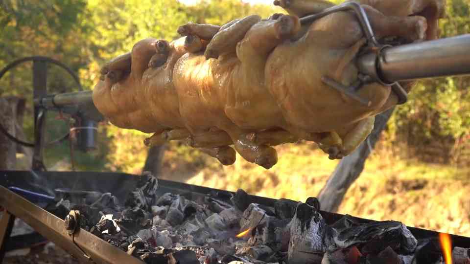 Mega chicken roast: Six stuffed chickens roasted on a spit
