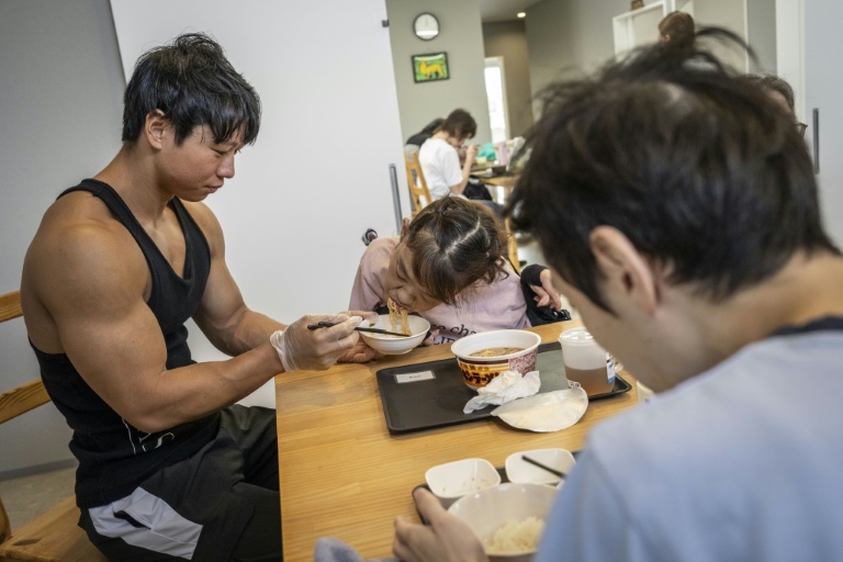 Young bodybuilders lift Japan's ailing care sector