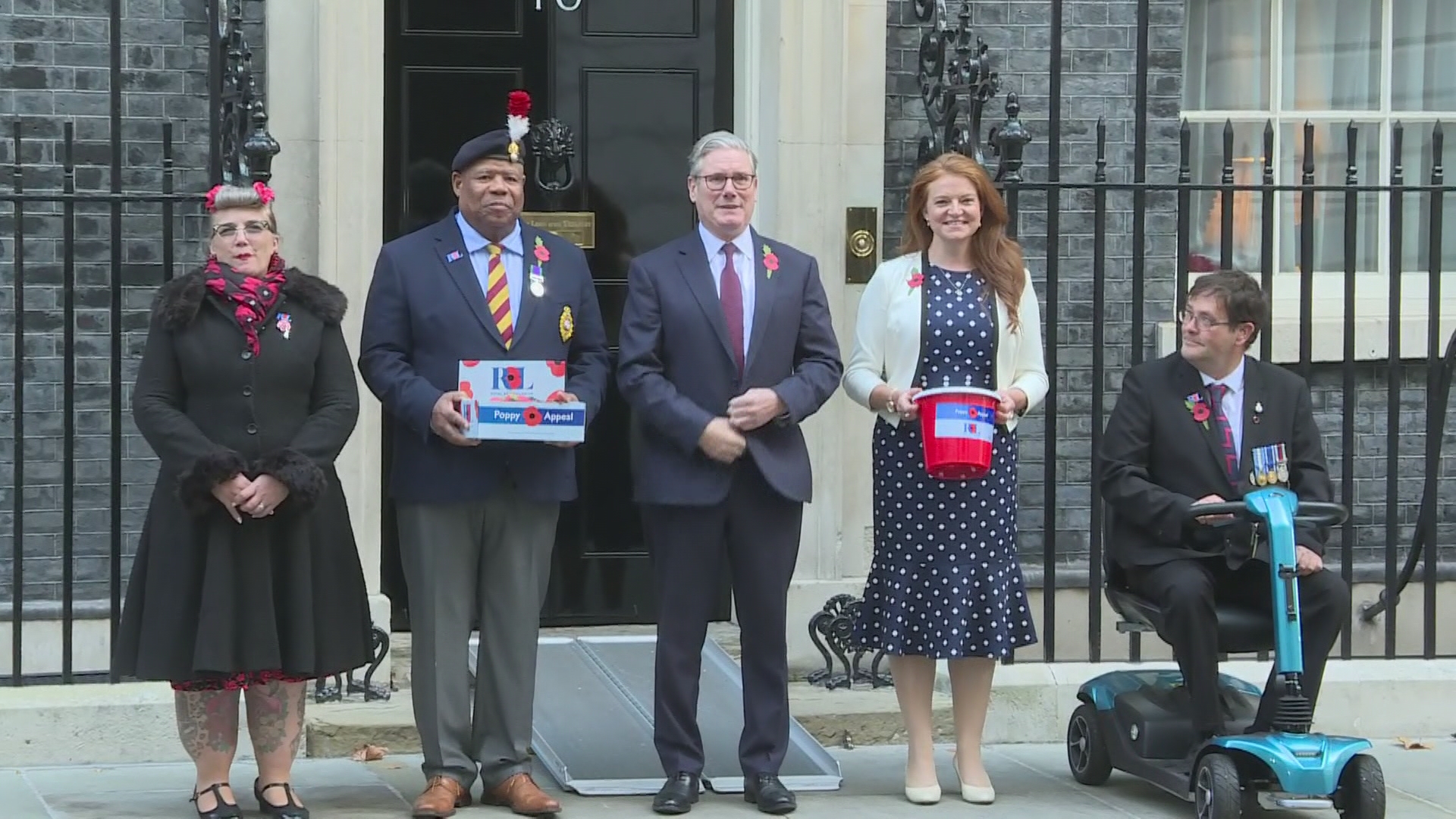 Sir Keir Starmer buys a poppy outside No 10