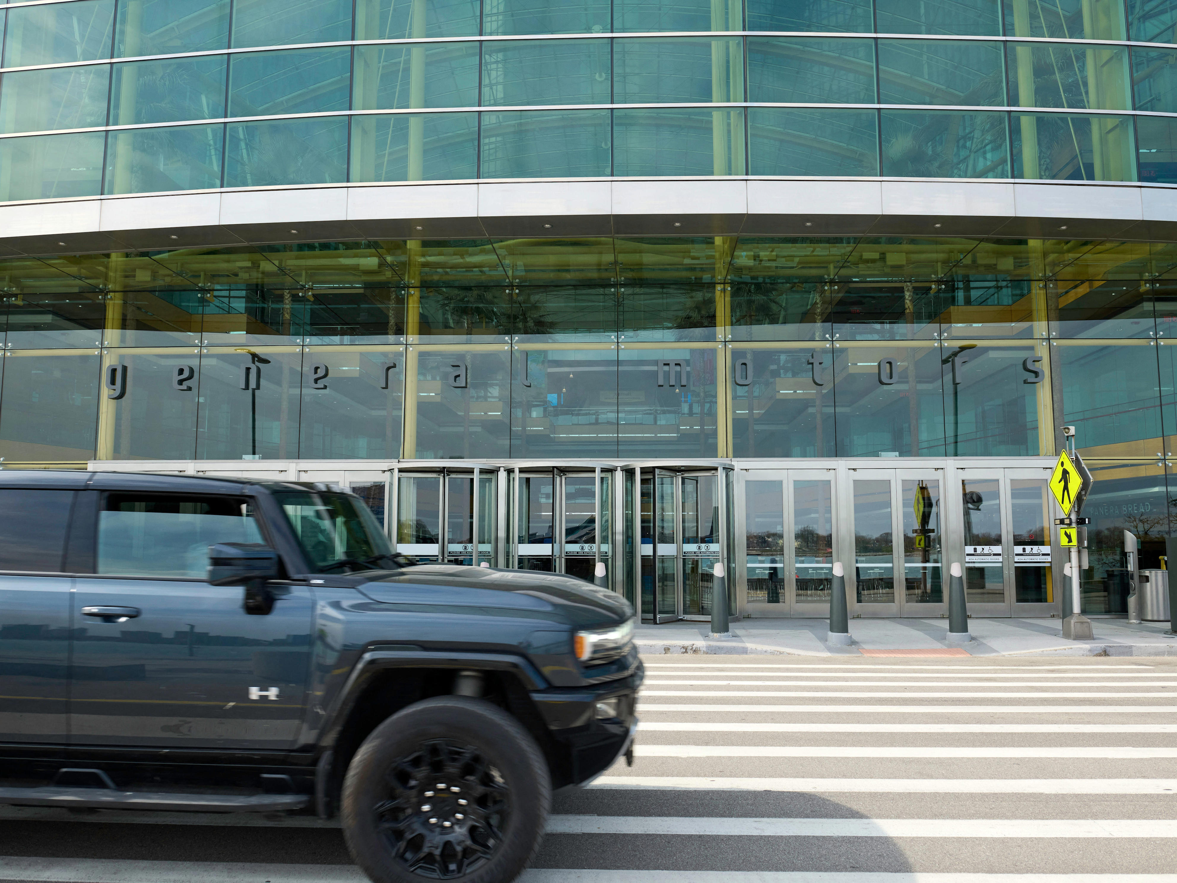 GM lays off hundreds of workers while restructuring its design ...