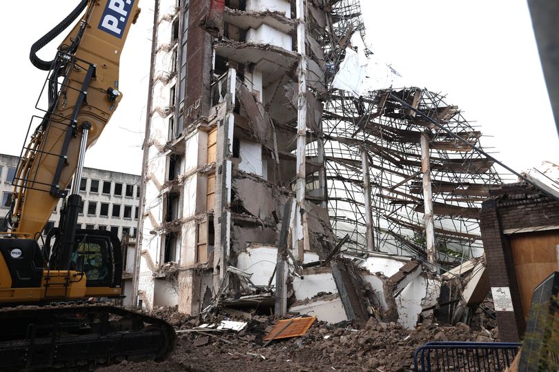 Building collapses in dramatic scenes in city centre