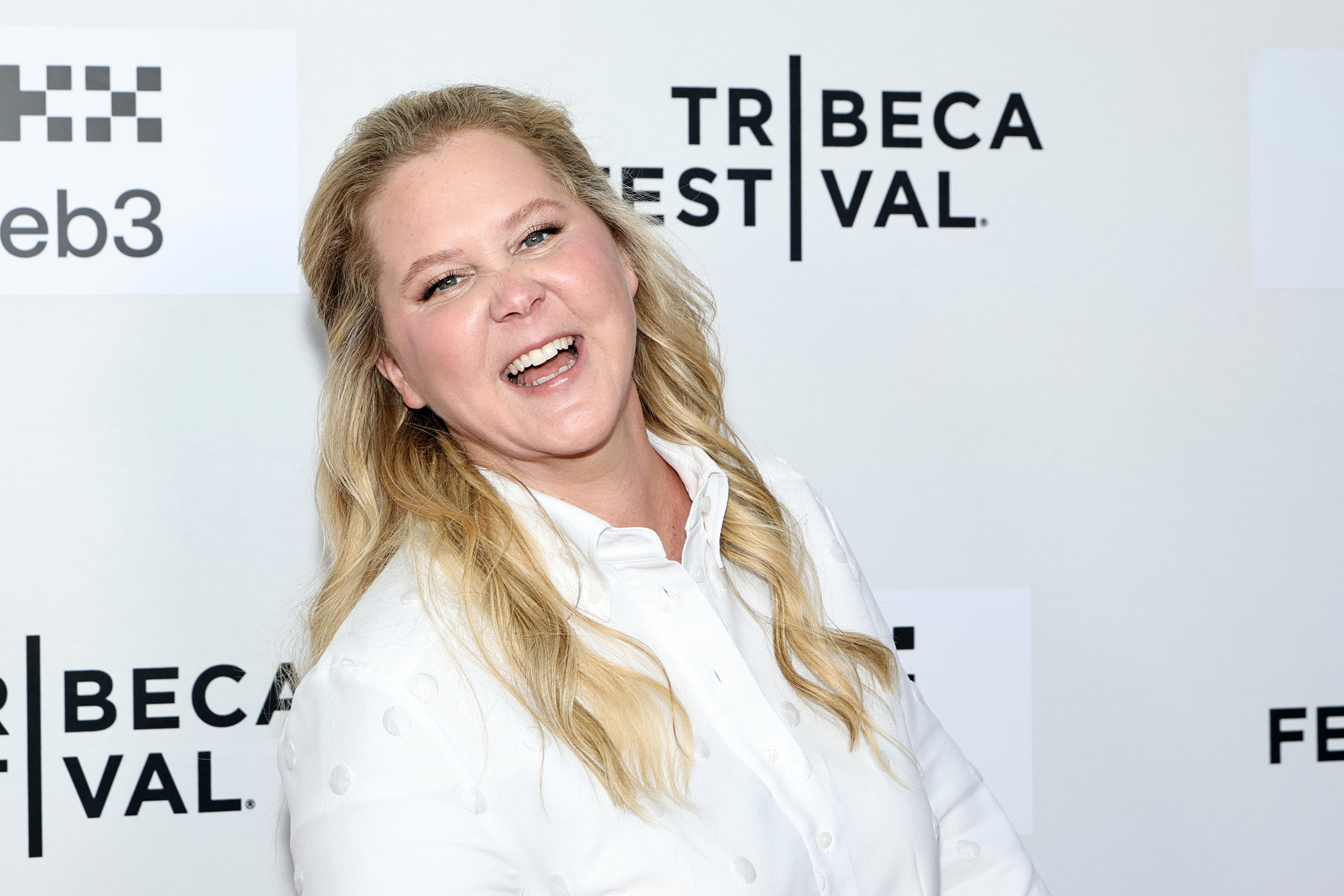 Amy Schumer shares glam new Instagram pics, with adorable photobomb