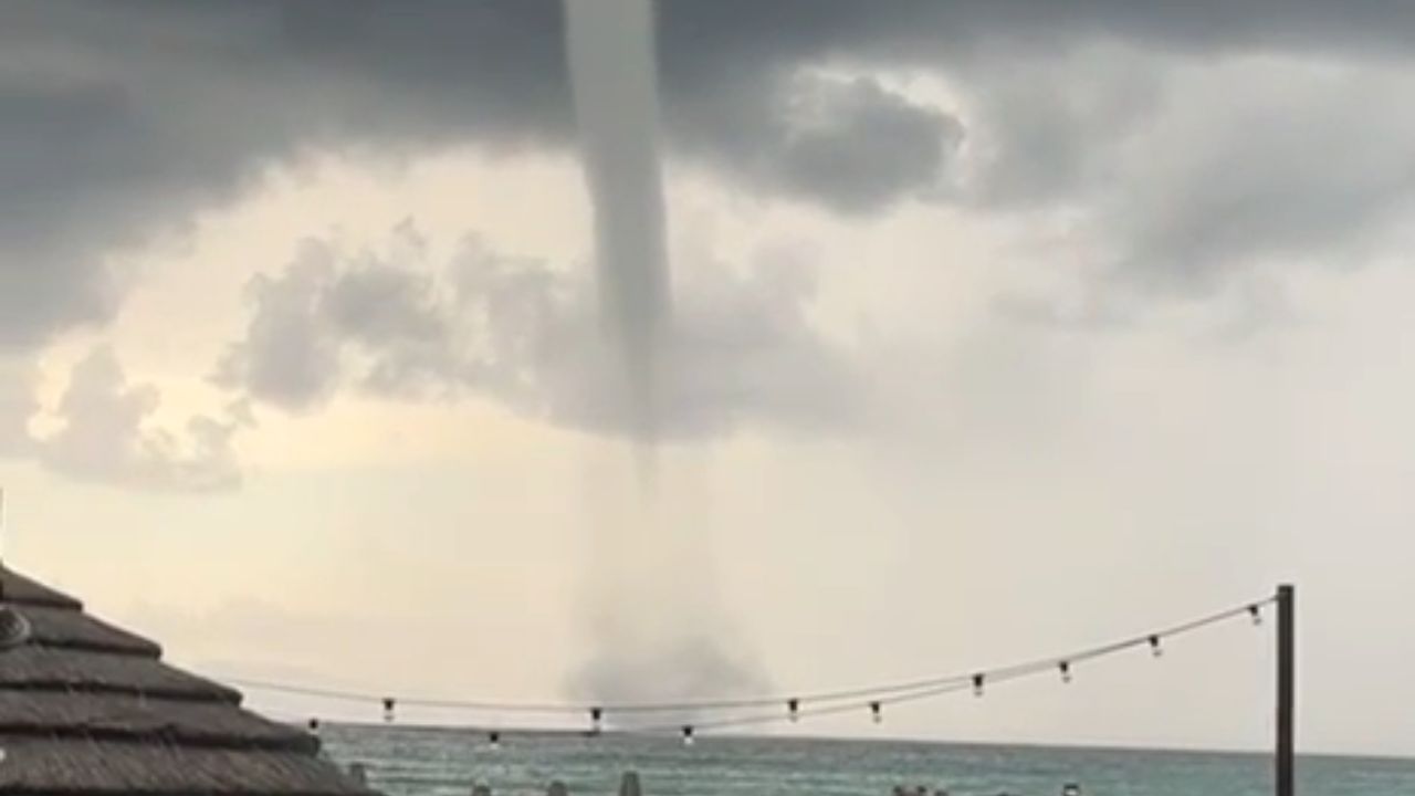 Rare waterspout over Cagliari waters leaves onlookers amazed