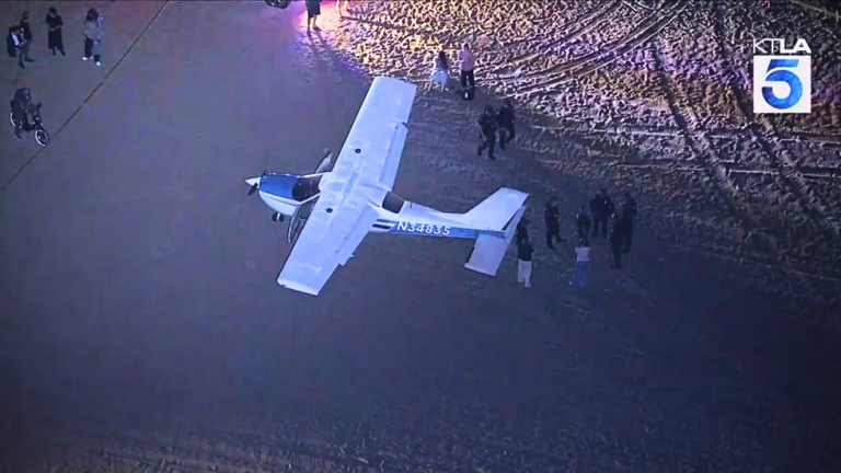 Pilot lands plane on Huntington Beach sand after engine failure