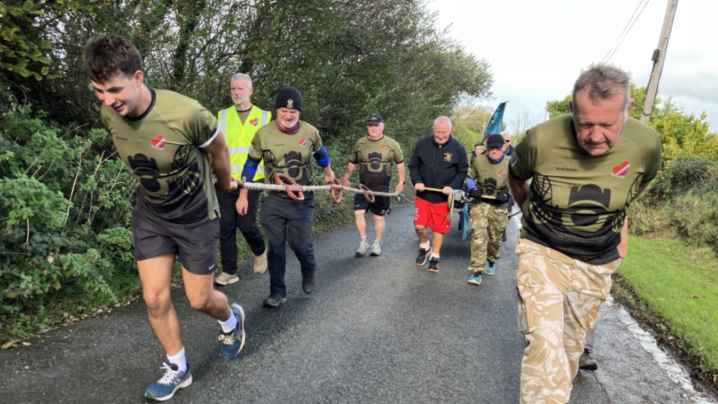 Charity team pulling field gun across South West