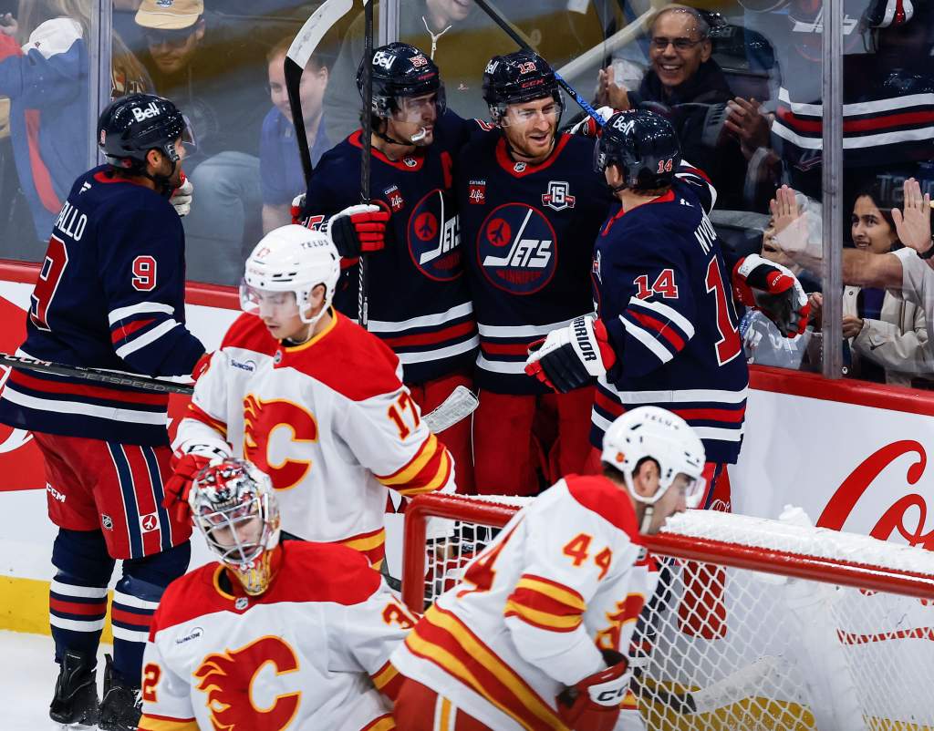 Winnipeg Jets ride four-goal second period to down Flames 5-3