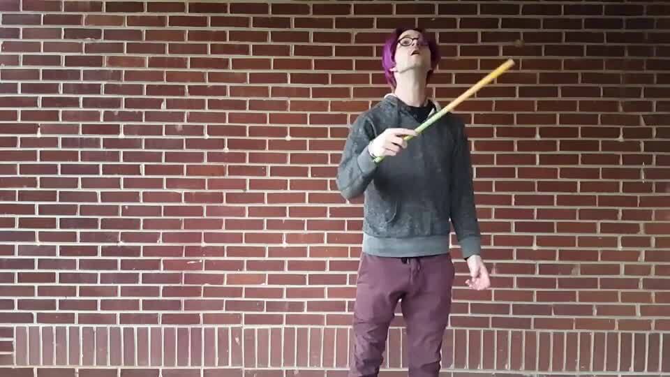 Guy Juggles Sticks