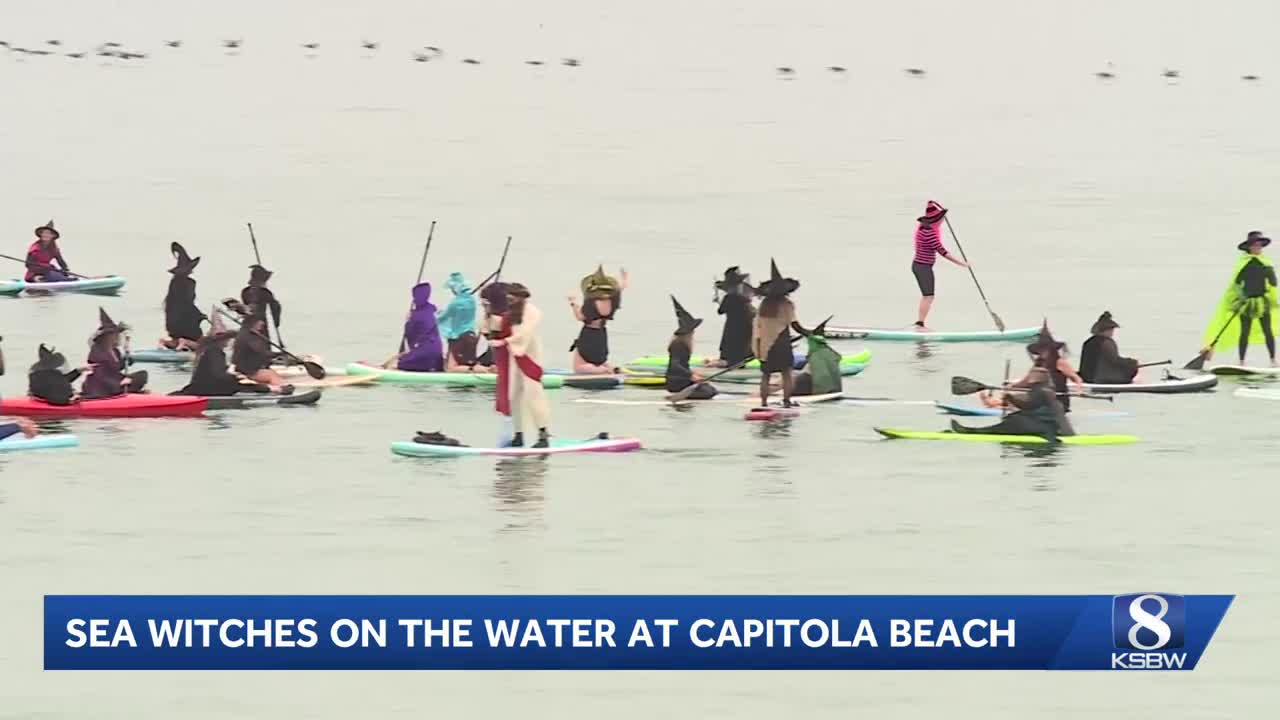 Witches paddleboard in Capitola in an annual tradition