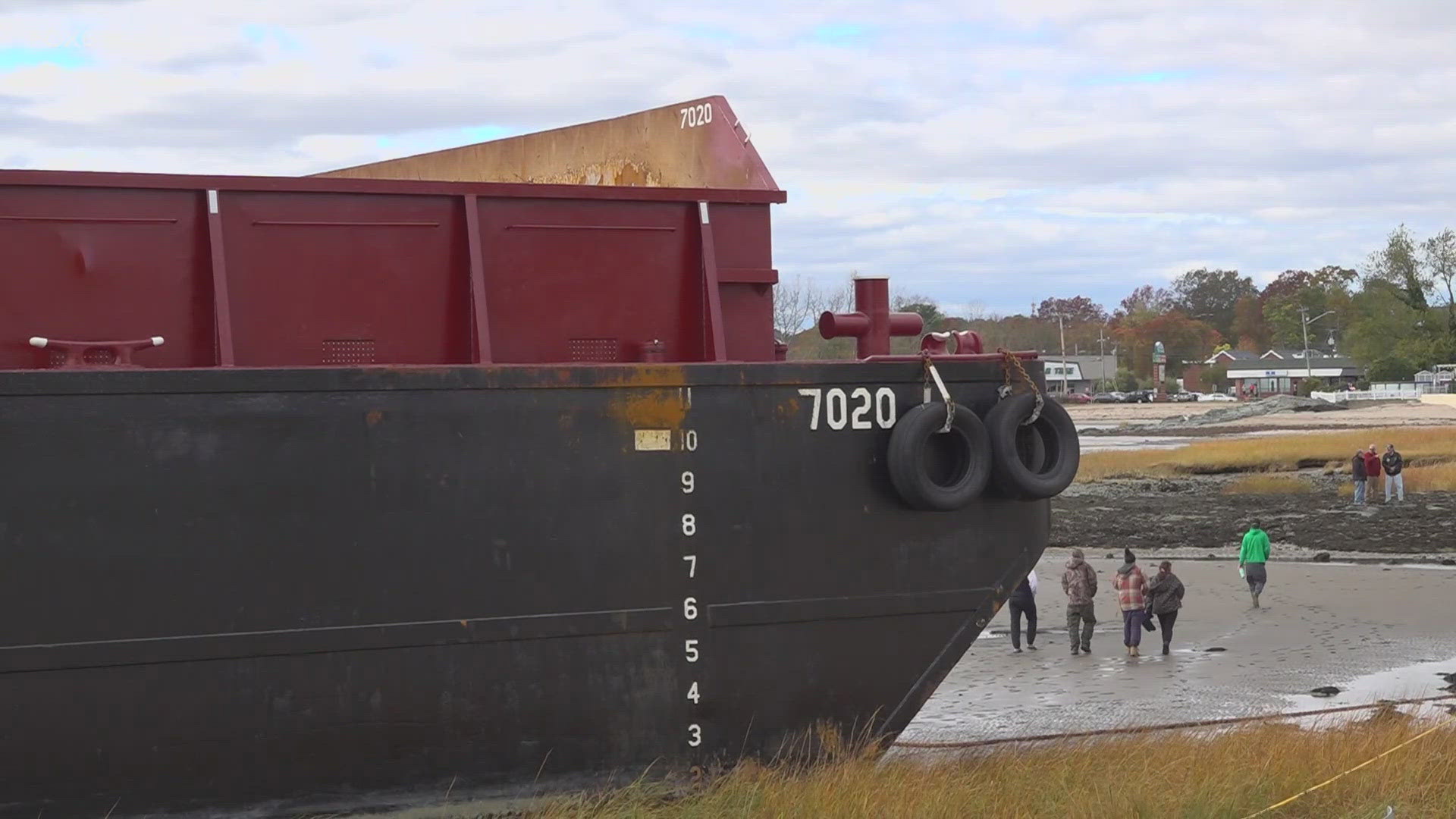 Loose barges in Connecticut wash ashore in West Haven, draw big crowd