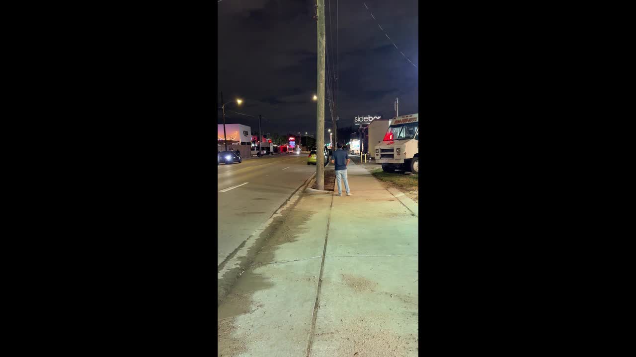 Inflatable chicken mascot rides electric unicycle in Houston, Texas, USA