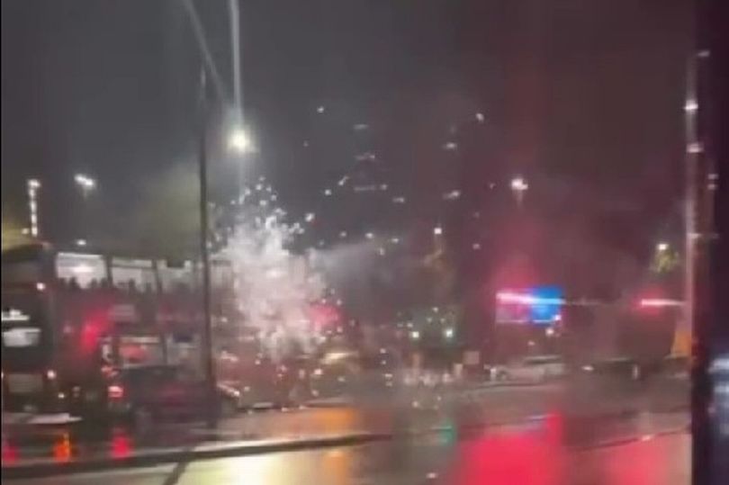 Moment yob blasts bus with fireworks in Birmingham city centre rampage