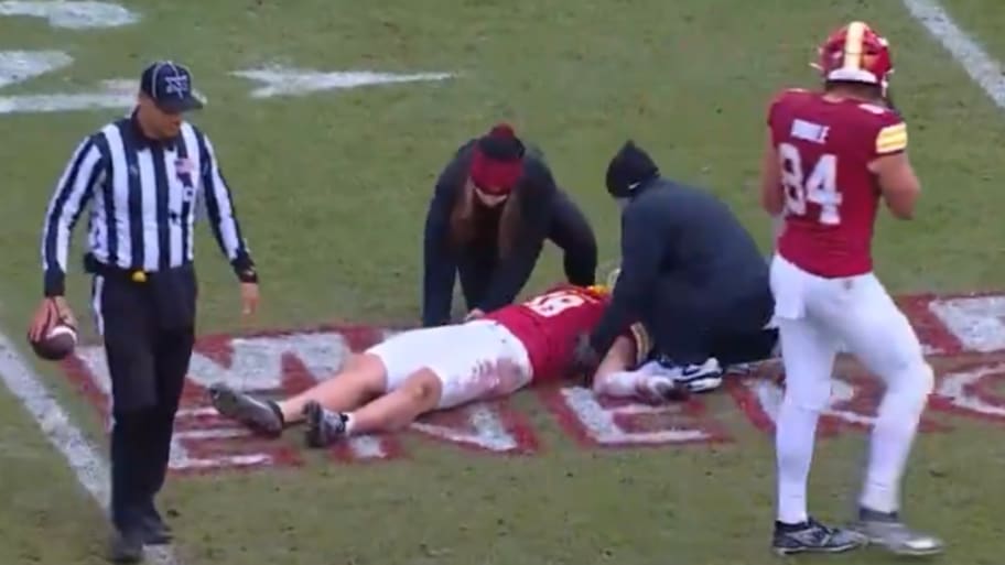 College football player taken to hospital after collapsing on field ...