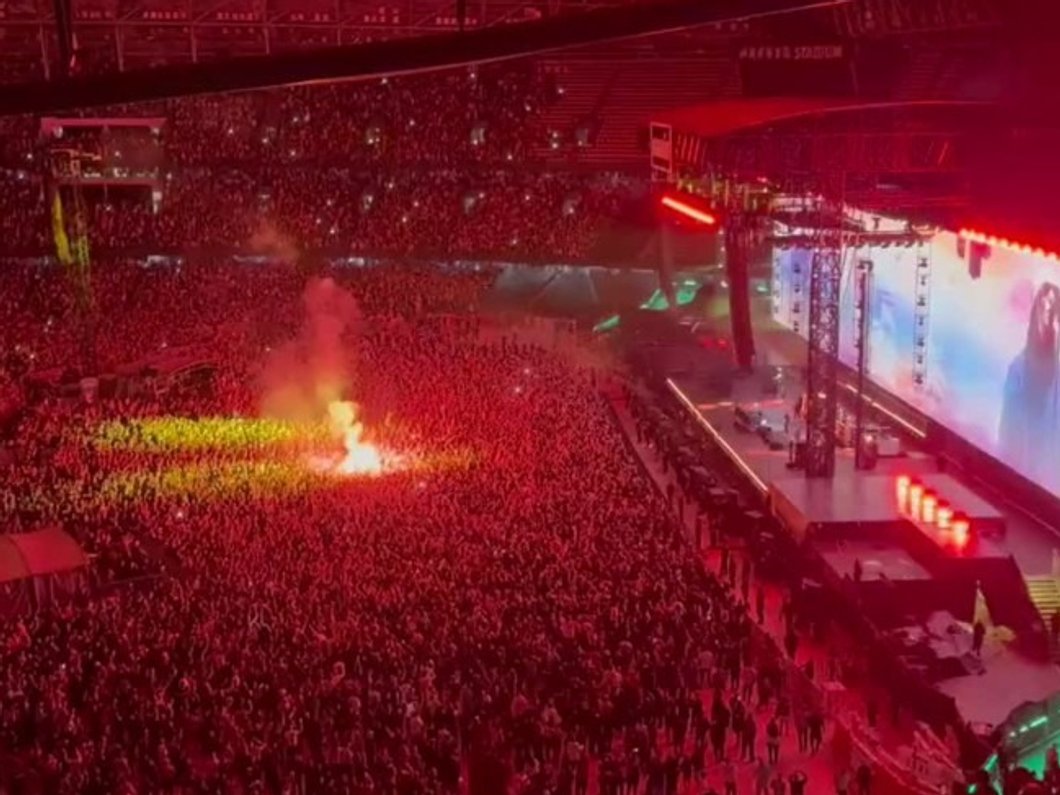 Fire mayhem at Oasis show as fan hurls flares into crowd