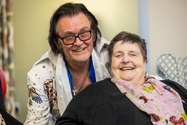 Care home resident thrilled as Elvis tribute makes surprise visit
