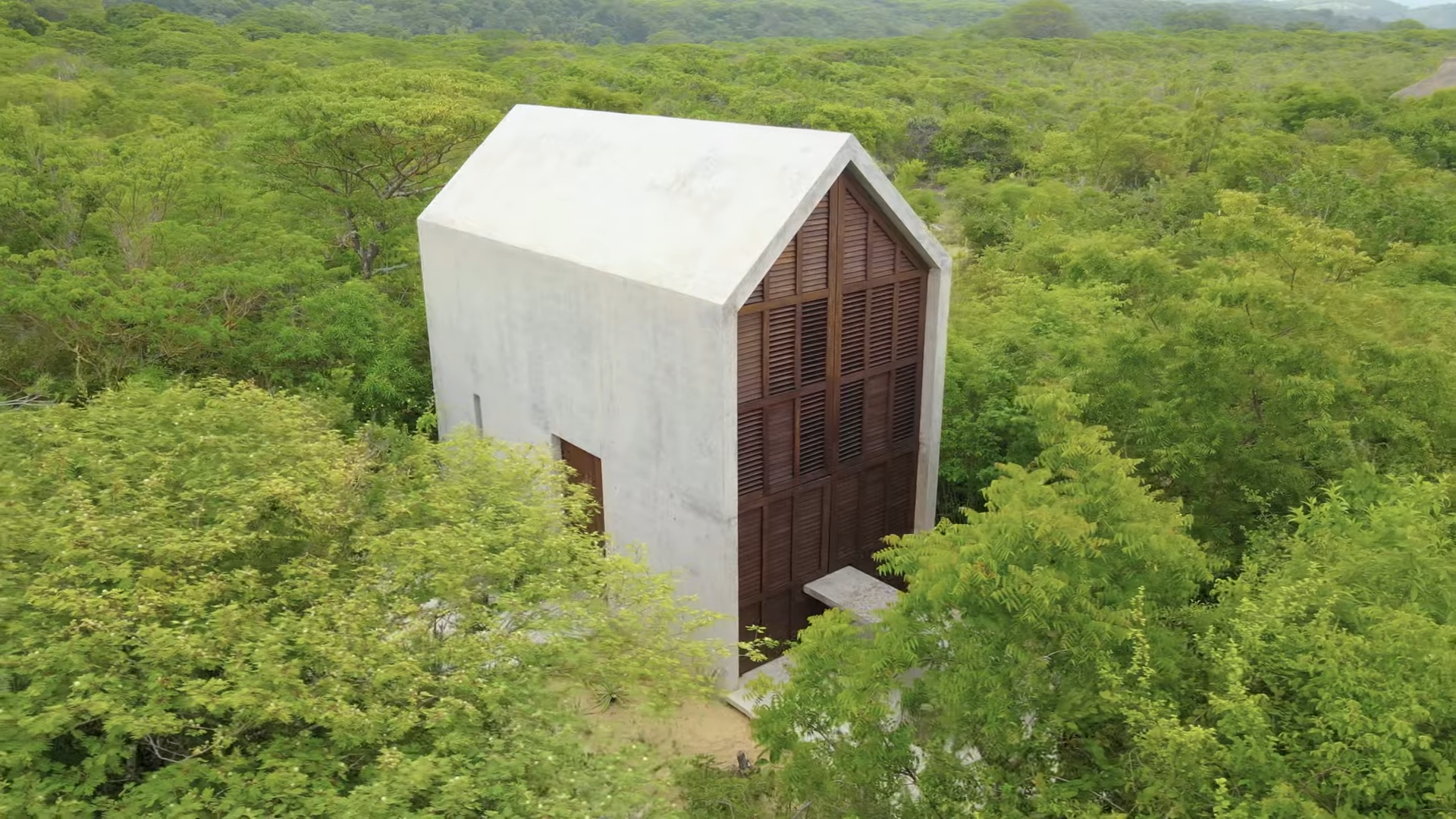 Two-story minimalist jungle retreat
