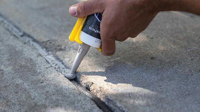 The Affordable Tool That Can Fill Cracks In Your Concrete Driveway
