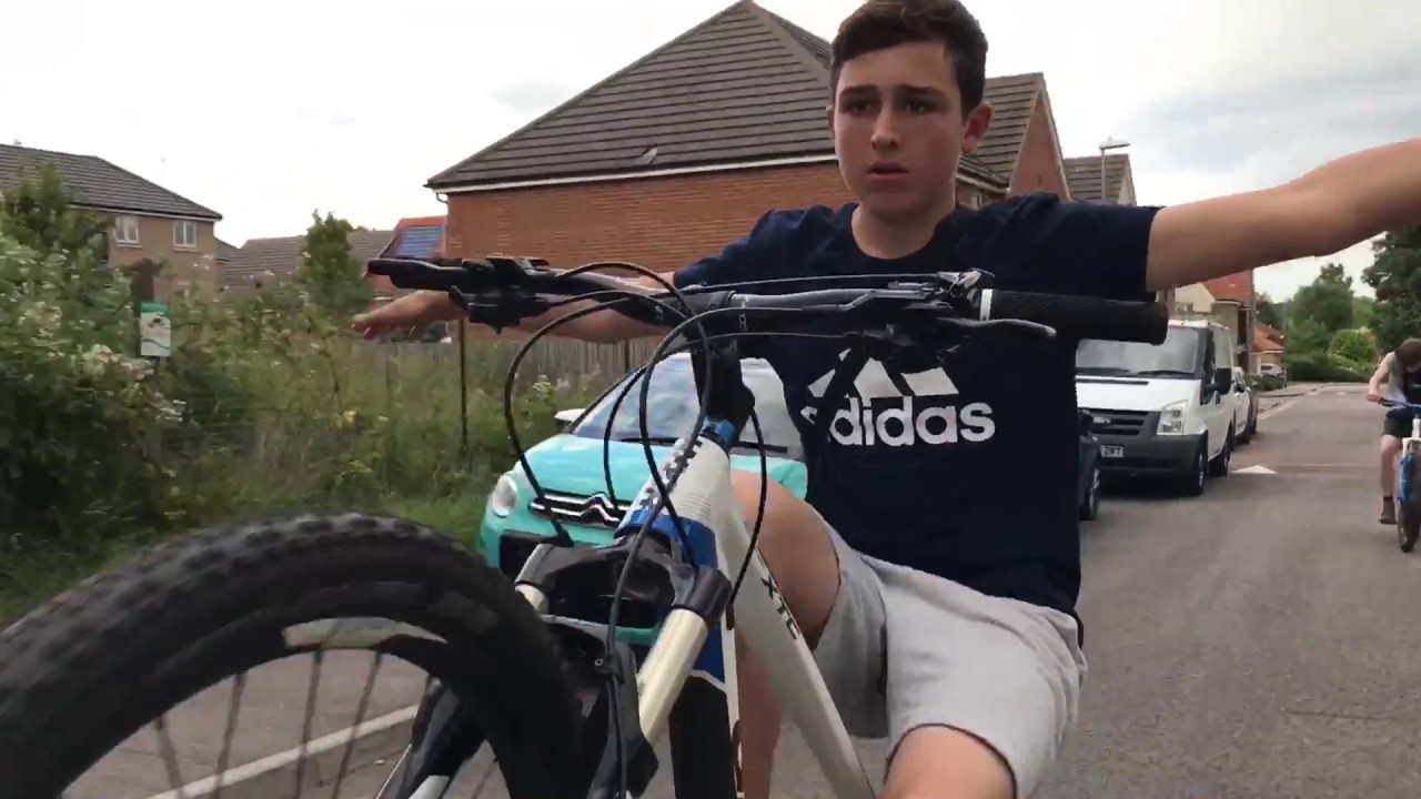 After school wheelie session through city streets