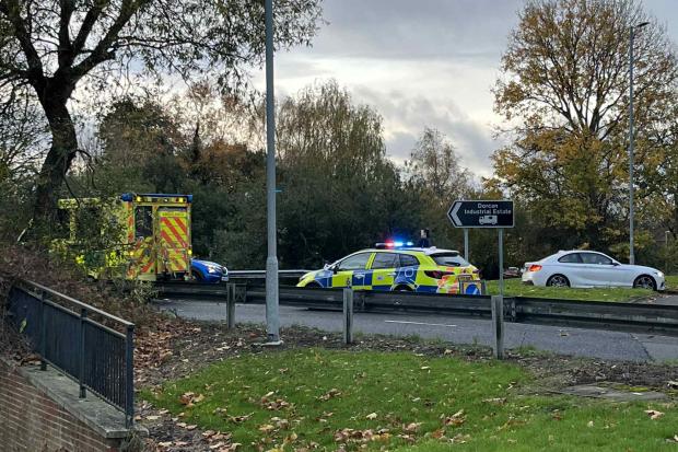 Emergency services respond to incident on busy roundabout