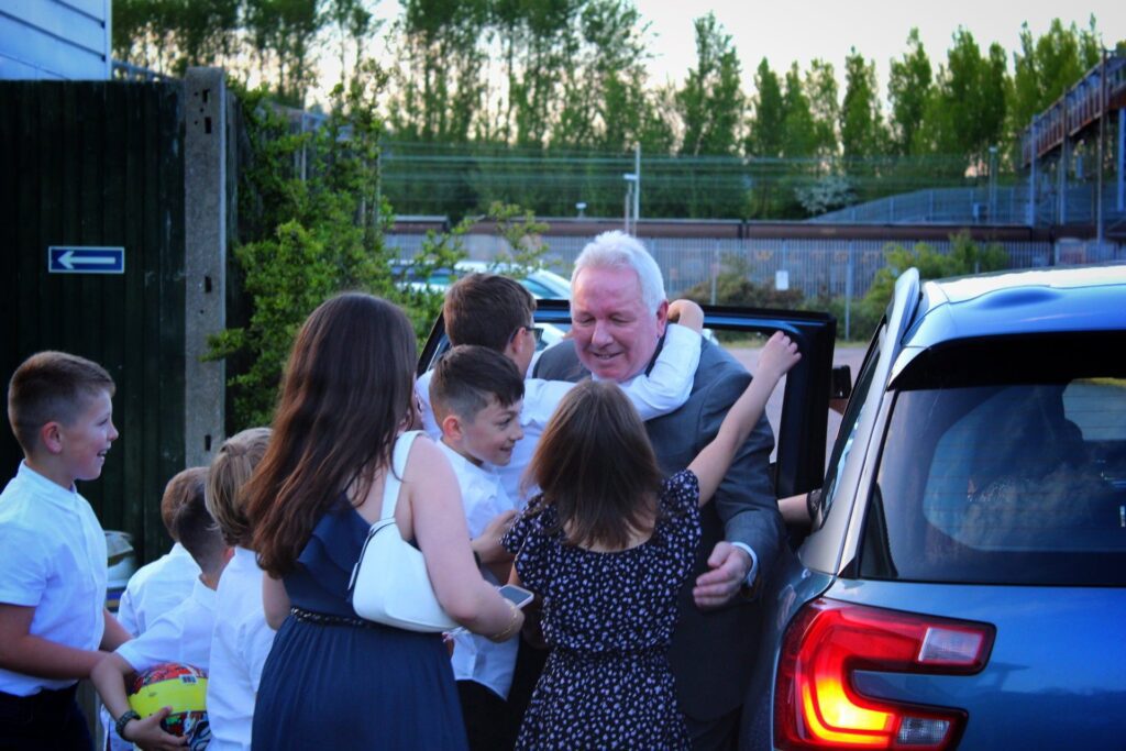 Dad’s emotional reaction as 170 show up for surprise birthday party