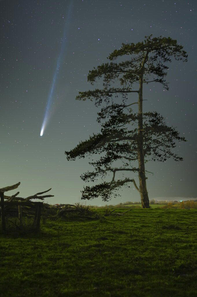 Comet snapped streaking over iconic Lancaster bomber sculpture