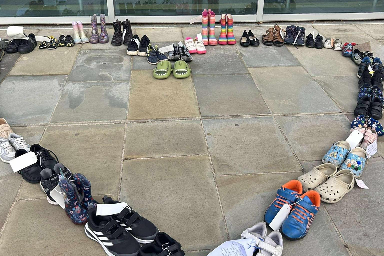 Families place children's shoes outside Doncaster Council offices in ...