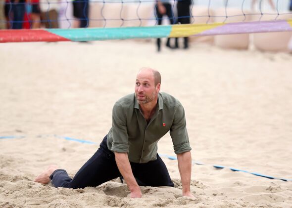 Prince William goes barefoot as he tries his hand at beach volleyball