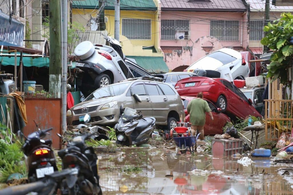 Typhoon Tino leaves 26 dead, people on roof and cars submerged
