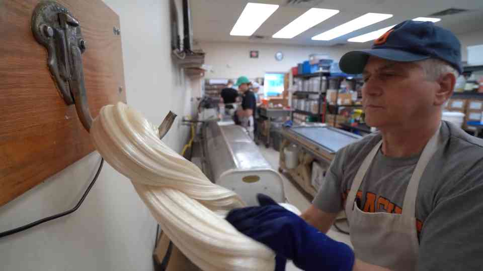How one candy maker is passing down the art of the candy cane