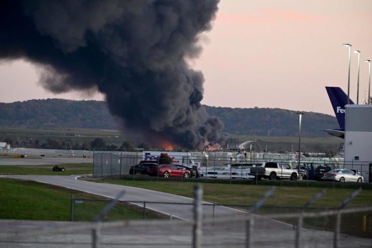 At least seven dead after UPS plane crashes in Kentucky, causing huge fire