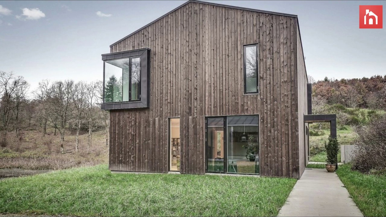 This timber-clad house seamlessly disappears into the forest