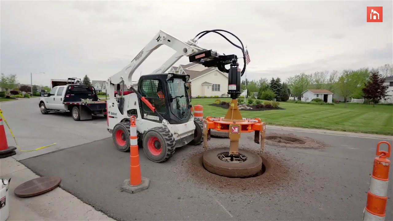 The machine that cuts perfect circles around manholes