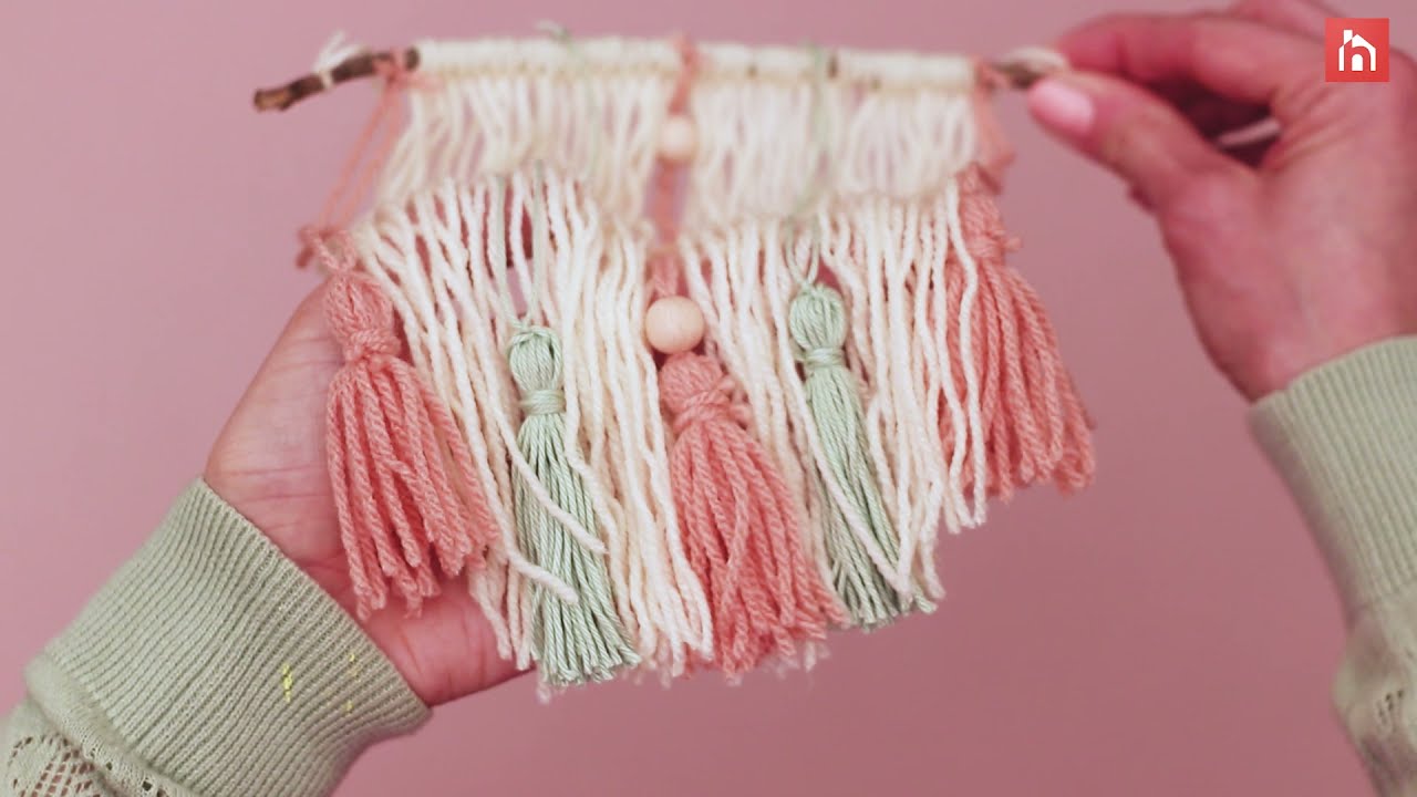 DIY wall hanging with yarn tassels