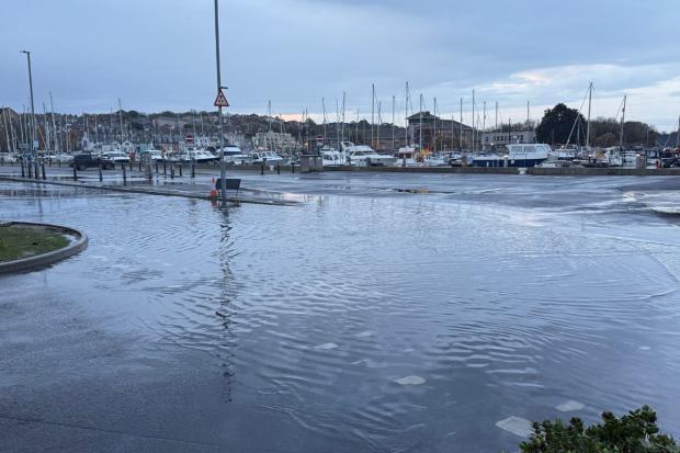 Road floods after high tides and wet weather as alert issued