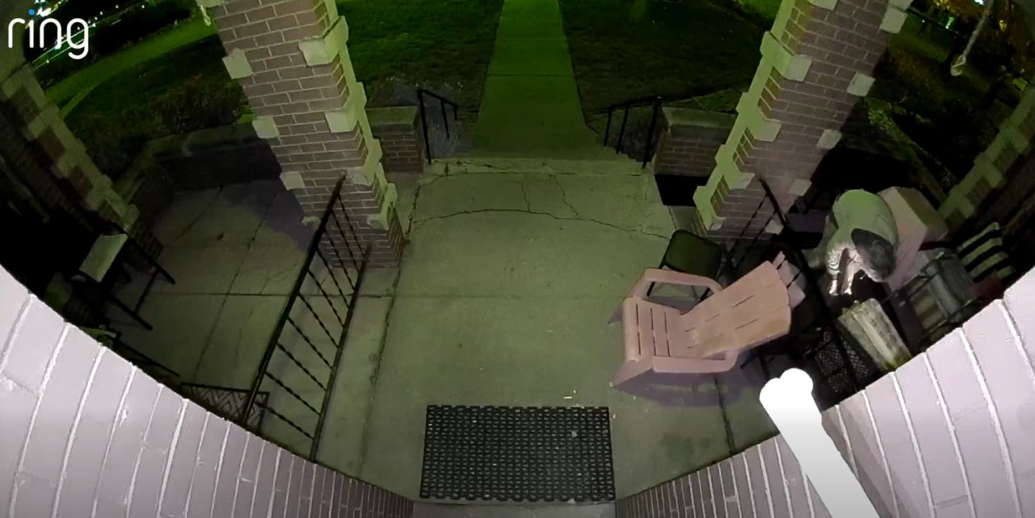Home security camera catches person setting porch furniture on fire
