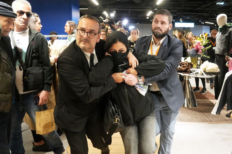 Protesters carry 'Shame on Shein' signs as fast fashion brand opens ...