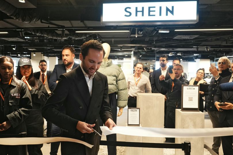 Protesters carry 'Shame on Shein' signs as fast fashion brand opens ...