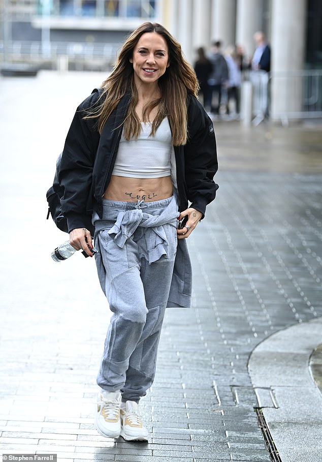 Mel C, 51, flashes her washboard abs in a crop top as she arrives at ...