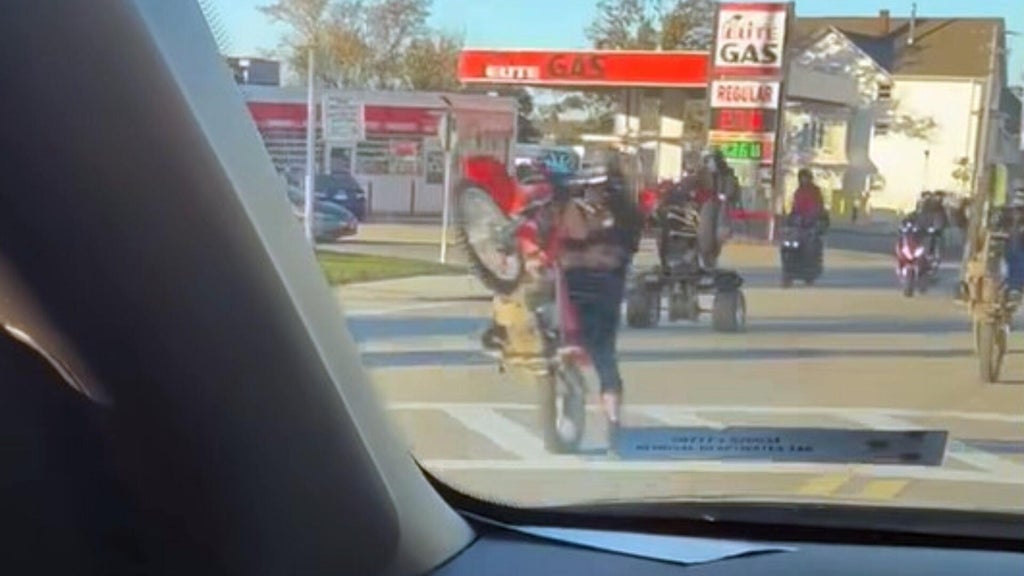 Nearly 100 people on dirt bikes, ATVs and scooters block traffic in ...