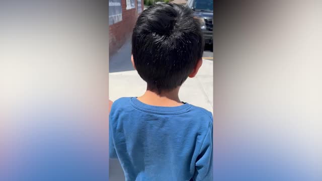 Police officer allows boy with autism to explore his police vehicle