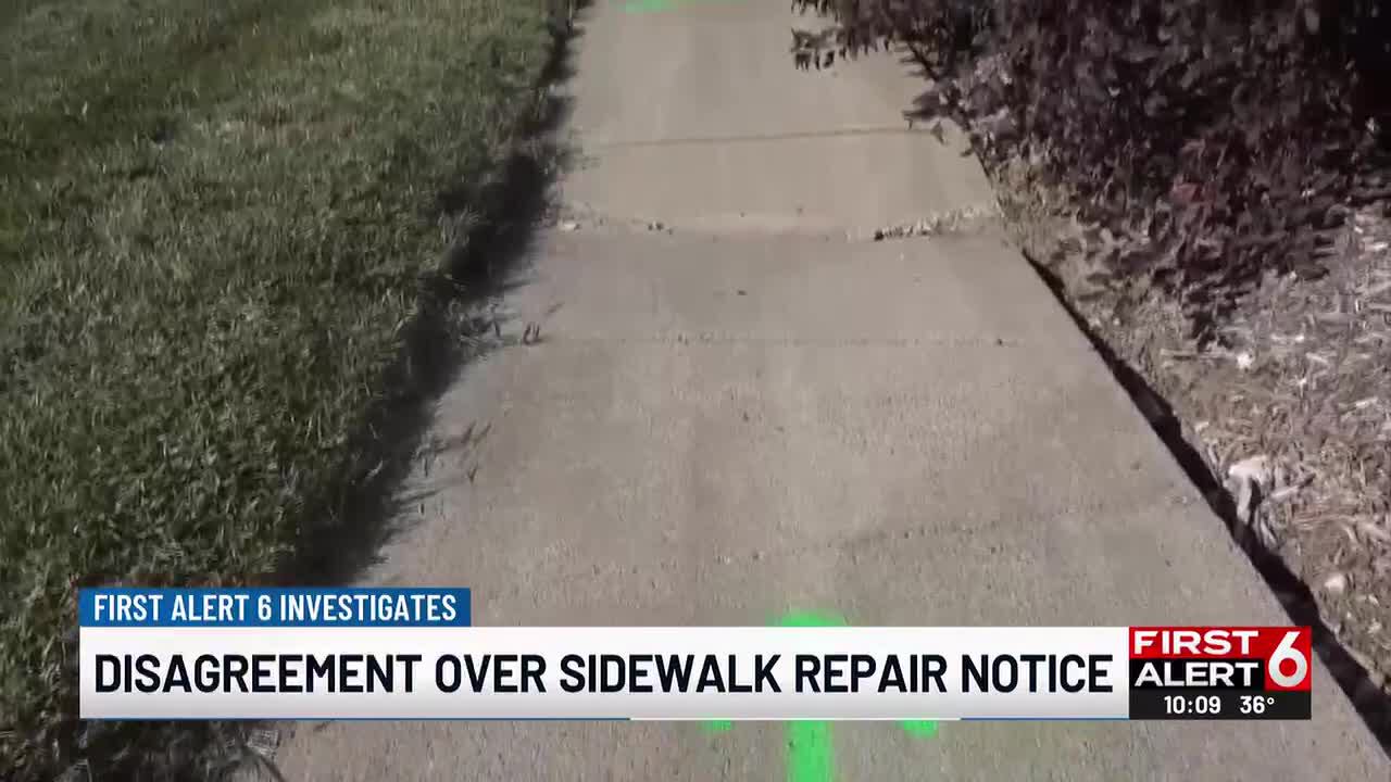 Omaha homeowner disputes sidewalk repair order for panels beyond fence