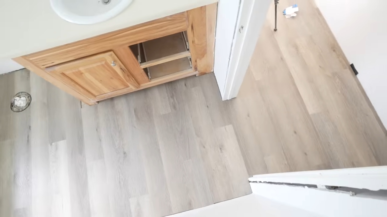 How to install vinyl plank flooring in a bathroom over tile