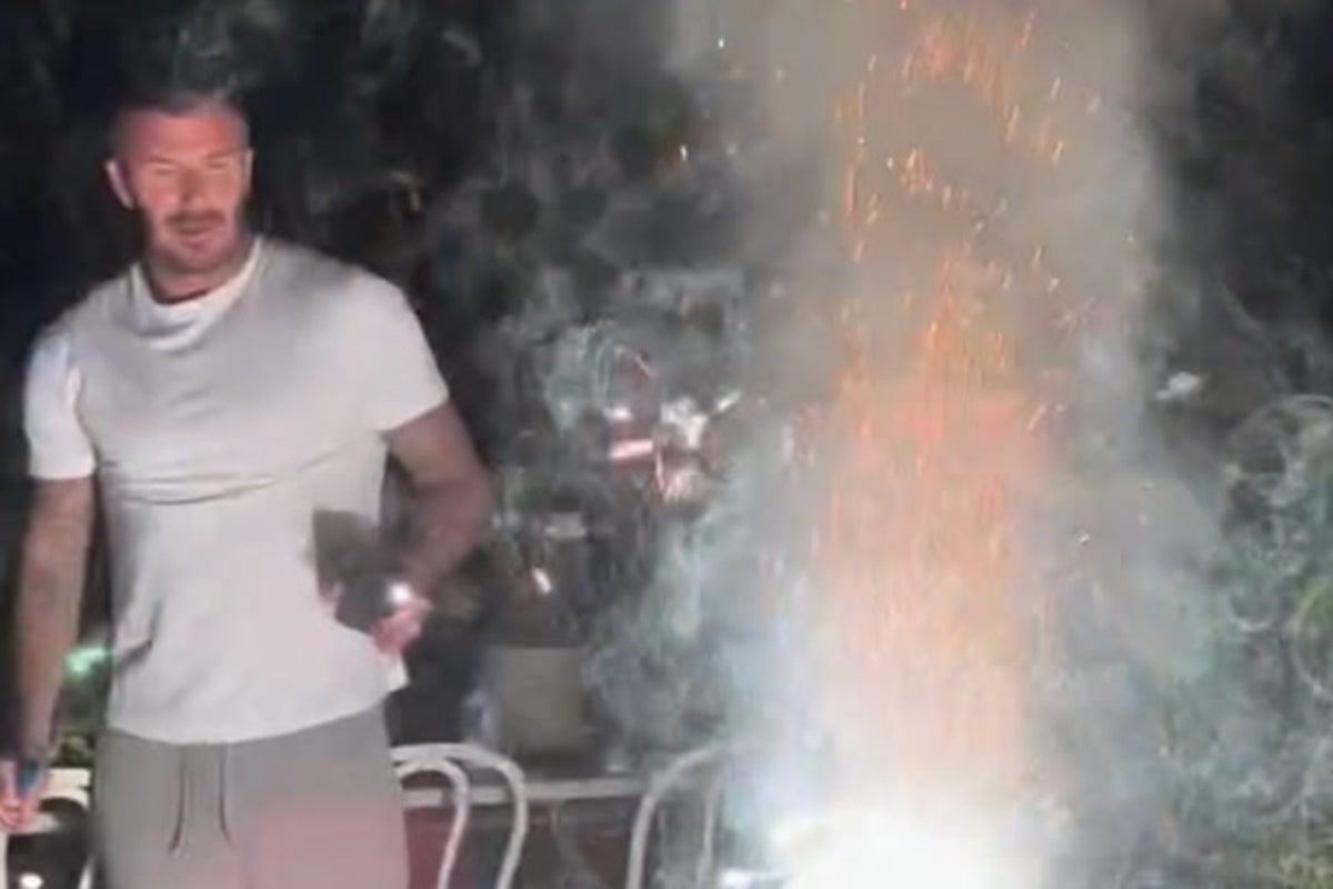 David Beckham runs for cover as firework explodes in front of him