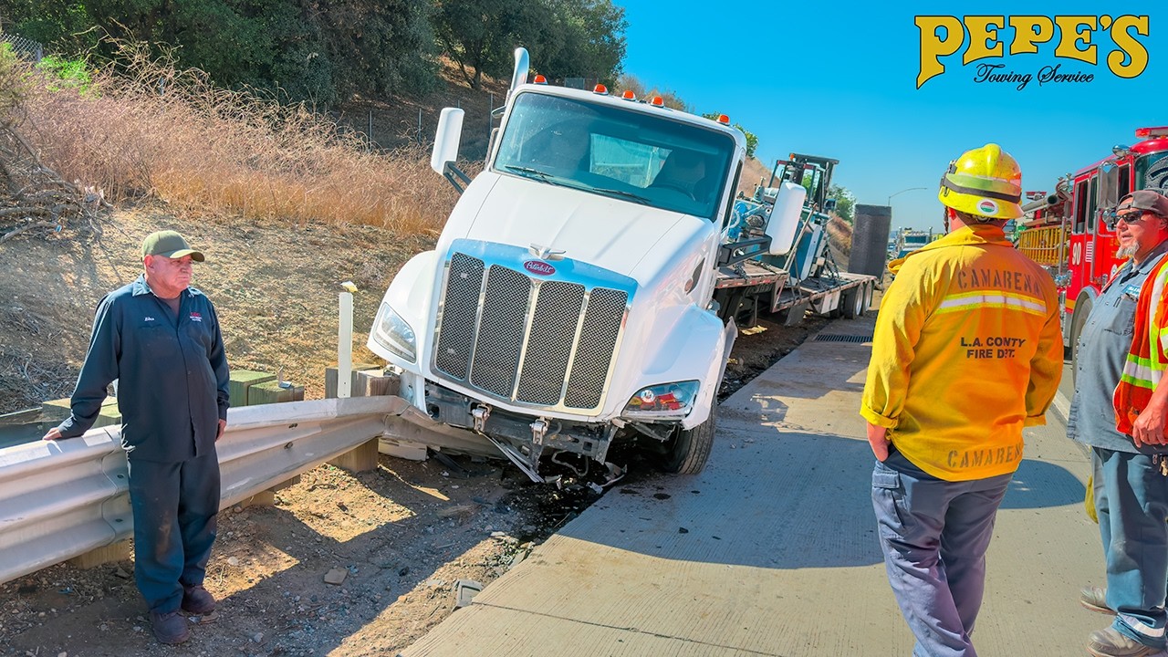 Flatbed Crashes and Gets Stuck on Guardrail