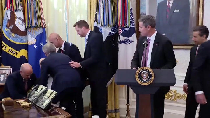 Trump Freezes as Man Collapses Right Behind Him in Oval Office