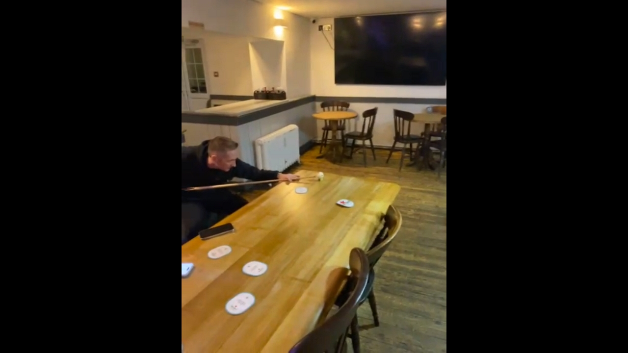 Man performs incredible billiard trick shot from dining table in ...