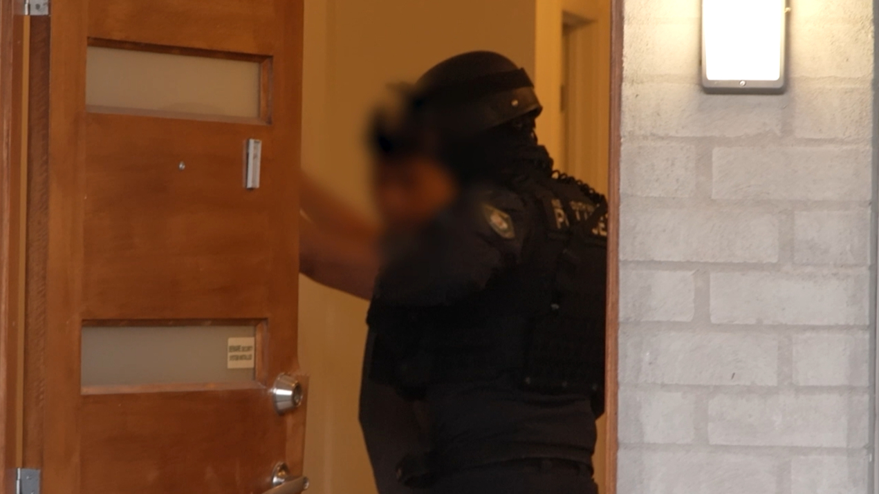 NAB employee charged over alleged role in $150m fraud syndicate