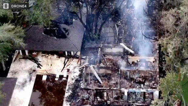 Miami Heat coach Erik Spoelstra seen outside as massive fire engulfed his Miami mansion