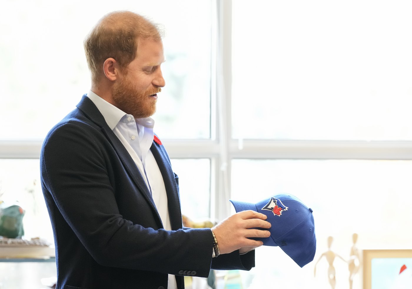 Prince Harry jokes he was 'under duress' while wearing Dodgers cap at ...