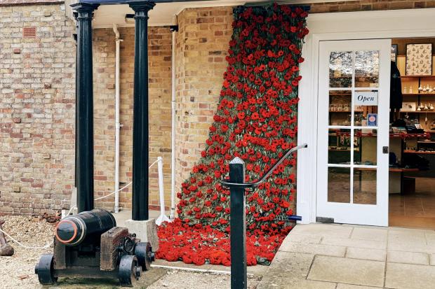 Striking knitted poppy curtain on display at Buckler's Hard in touching ...